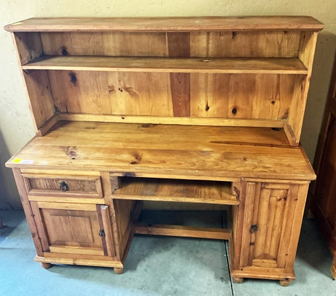 A pine desk hutch with character marks earned through years of service. Perfect for the home office or that kid who swears they'll do homework at it.