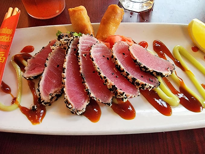 Sesame-crusted ahi tuna, seared rare and sliced like playing cards from a magician's deck, arranged with artistic sauces that taste as good as they look.