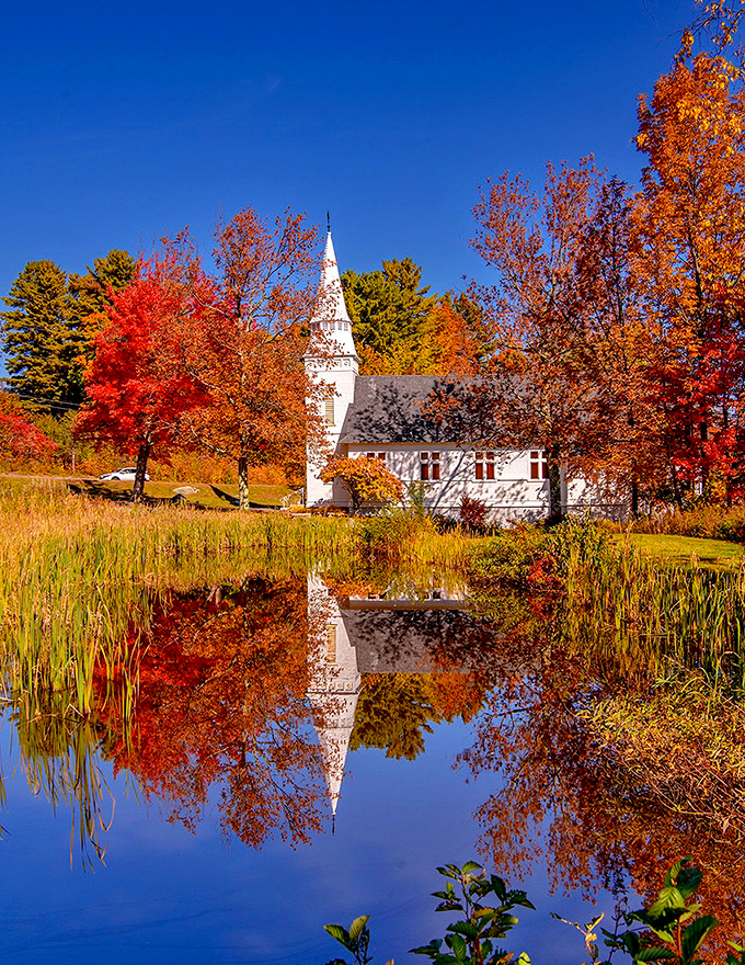 The white church reflected in still waters isn't just a postcard&mdash;it's a reminder that some places still exist exactly as you hoped they would.