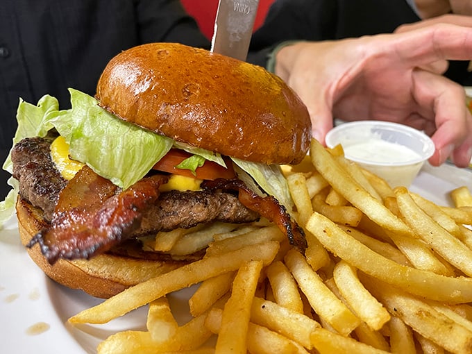 This isn't just a burger&mdash;it's architecture. The structural integrity of that bacon-cheese stack deserves an engineering award.