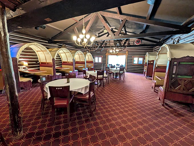 The booth seating area feels like dining in a luxury log cabin, where every meal comes with a side of Minnesota nostalgia and wagon wheel ambiance.