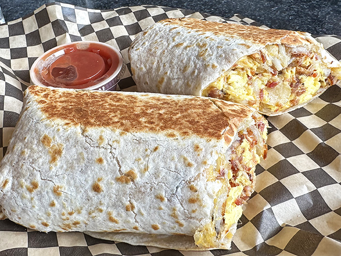 The breakfast burrito that requires a game plan. Perfectly grilled, stuffed with morning magic, and served on the iconic checkered paper.