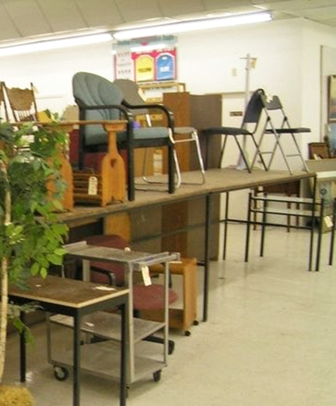 Office chairs and side tables create a mismatched symphony of functionality, waiting to solve someone's work-from-home dilemmas.