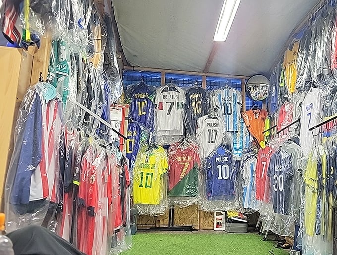 Soccer jerseys hang like colorful flags of international allegiance, each number and name representing someone's hero waiting to be adopted by a new fan.