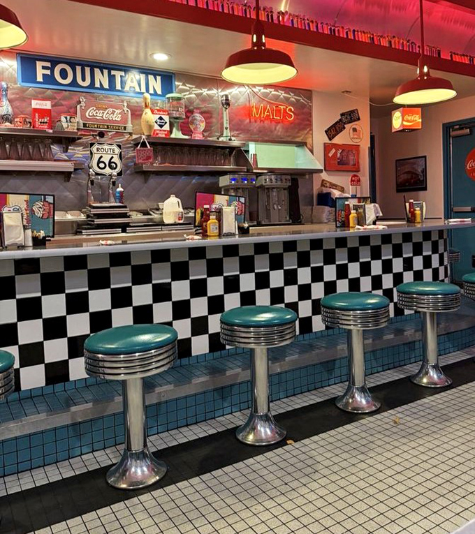 The counter seating&mdash;where solo diners become temporary family and milkshake decisions are debated with philosophical intensity.