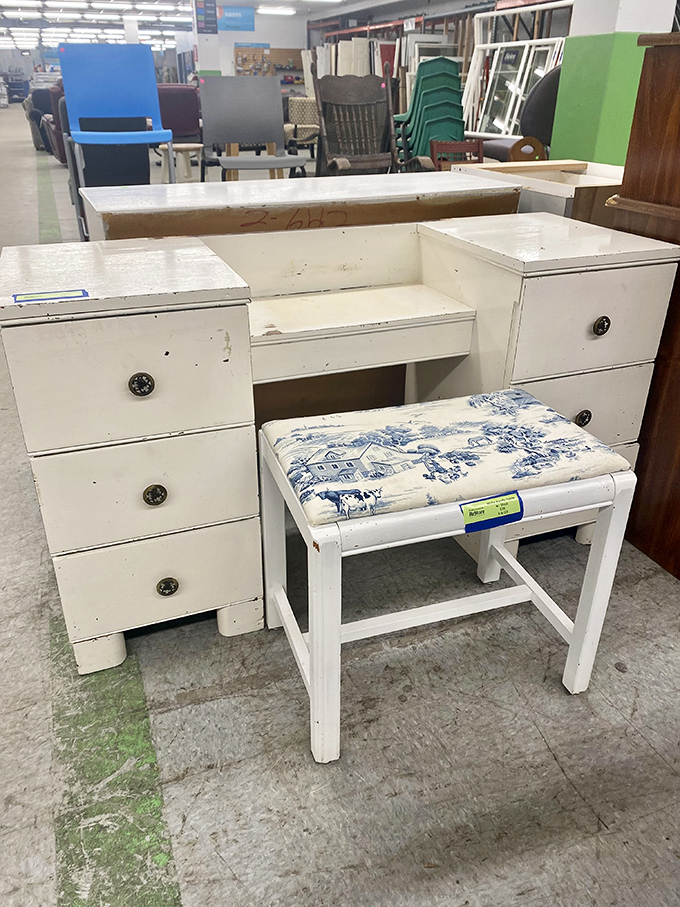 A charming white vanity with blue toile stool&mdash;perfect for writing letters nobody sends anymore or applying makeup with vintage flair.