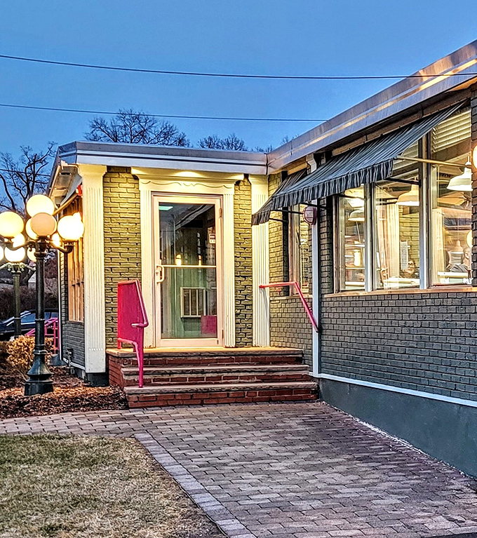 Dusk transforms the entrance into something from an Edward Hopper painting, minus the existential dread, plus the promise of pie.