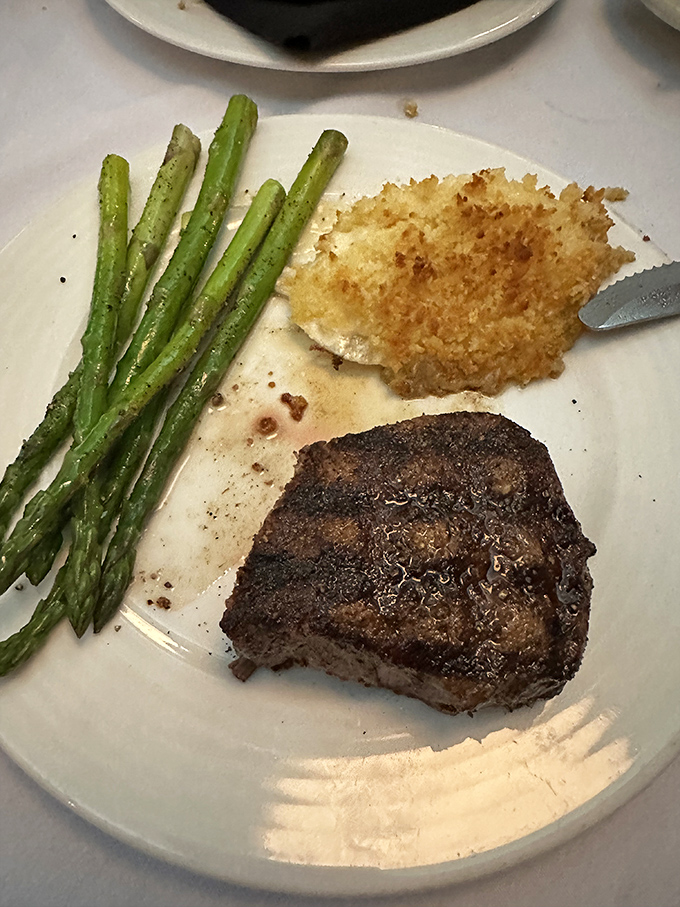 A perfectly cooked filet with asparagus and potato&mdash;the holy trinity of steakhouse excellence executed with the precision of a Mantle home run.