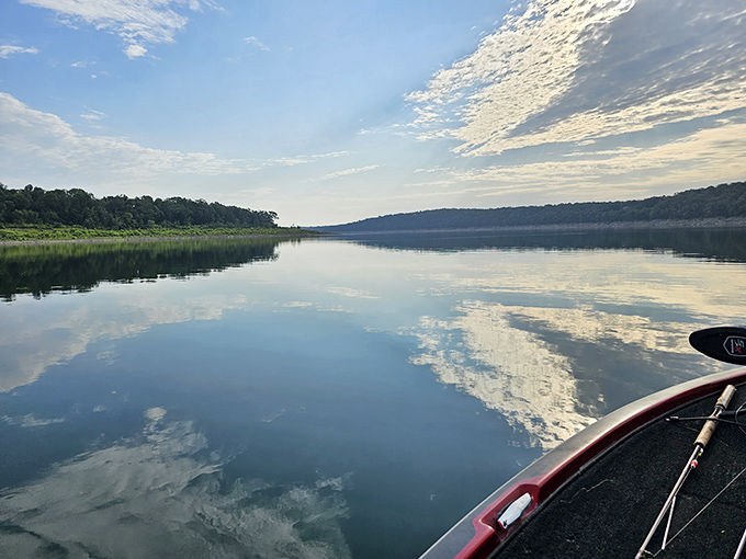 Mirror-perfect waters reflecting cloud paintings. Bull Shoals Lake on a calm morning makes you question which way is up.
