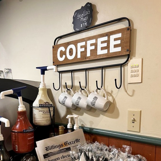 Coffee station goals: where mugs hang like trophies and the Billings Gazette waits to accompany your morning ritual.