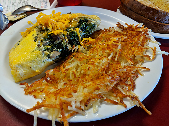 This spinach and cheese omelet with perfectly crispy hash browns proves breakfast is the most important meal of the day for good reason.