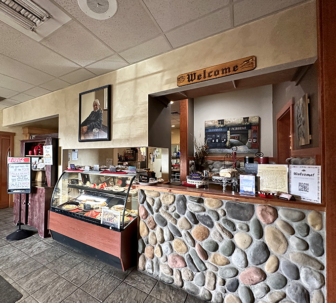 The welcome counter feels like coming home, if home had an impressive display of baked goods and friendly faces.