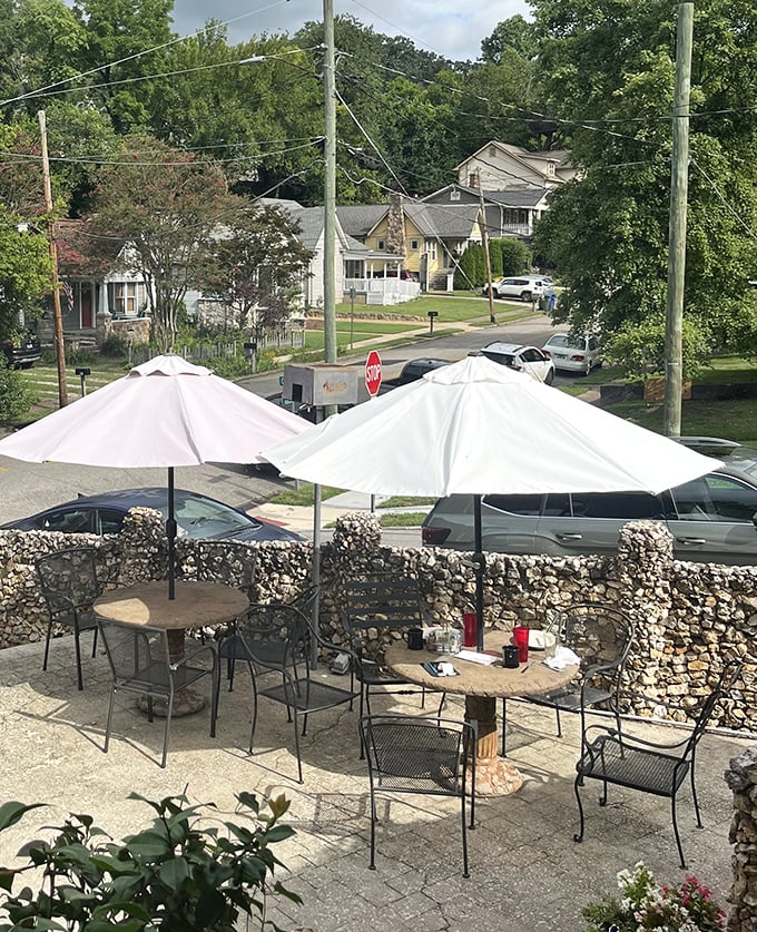The outdoor patio with stone pillars and umbrellas provides prime people-watching real estate while you digest.