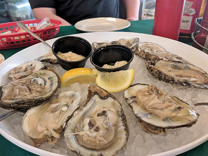 These oysters aren't just served; they're presented—a glistening sextet on ice with lemon wedges standing by for their supporting role.
