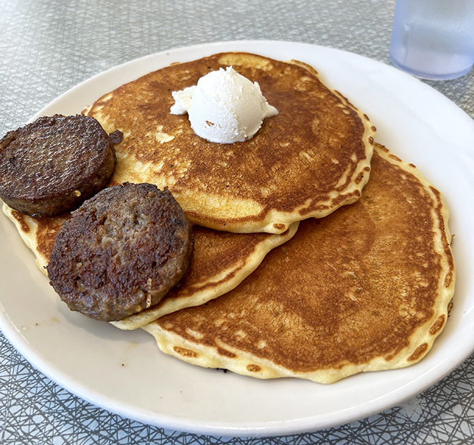 Golden pancakes with a dollop of butter melting into their fluffy souls&mdash;breakfast nirvana achieved.