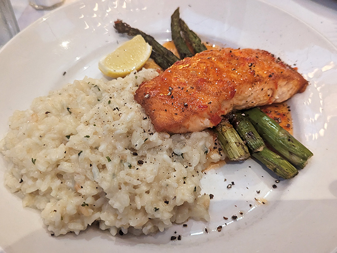 Salmon that's been kissed by fire, nestled on risotto like it's found its forever home.