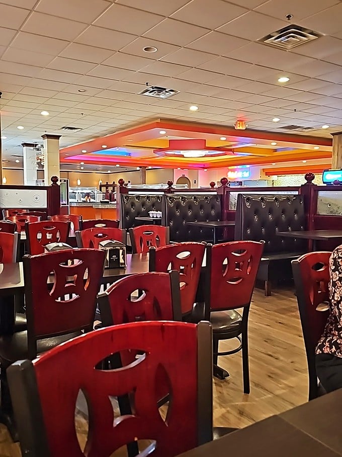 Red chairs pop against warm wood floors, creating a dining room that's both festive and comfortable&mdash;perfect for the food coma that's inevitably coming.