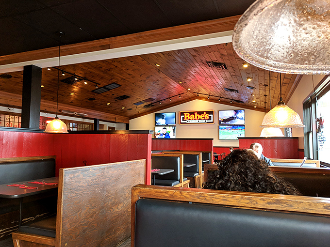 Wooden ceiling beams and cozy booths create dining spaces that feel like your own private corner of Harbor Point hospitality.