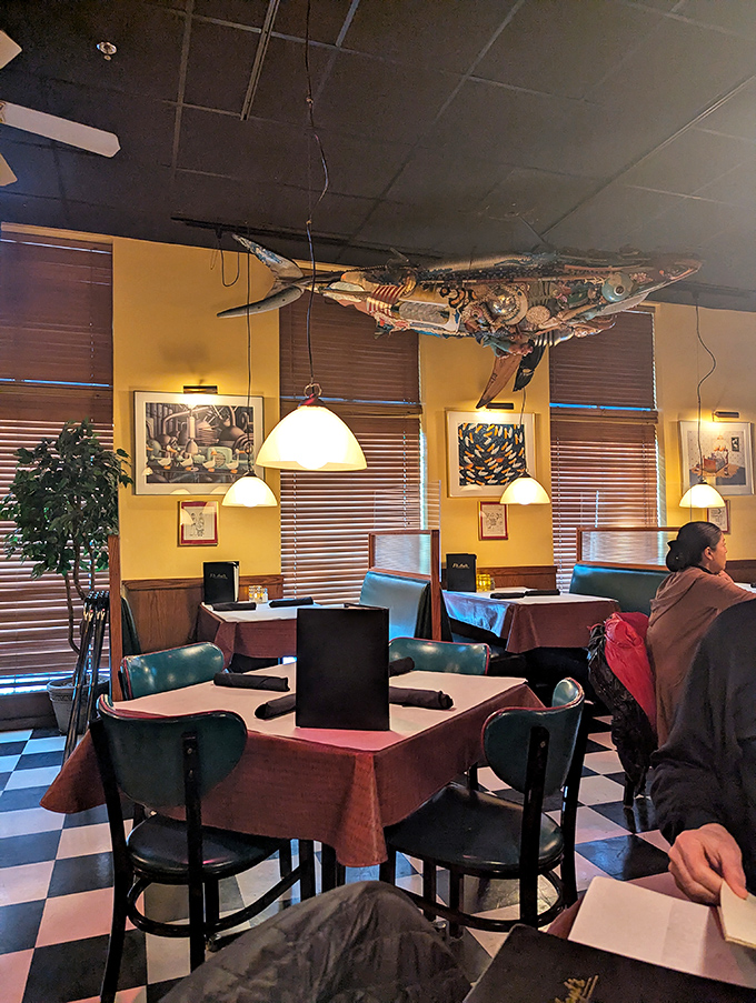 That suspended fish watching over diners like a guardian angel of seafood. The yellow walls radiate warmth even on the coldest Minnesota nights.