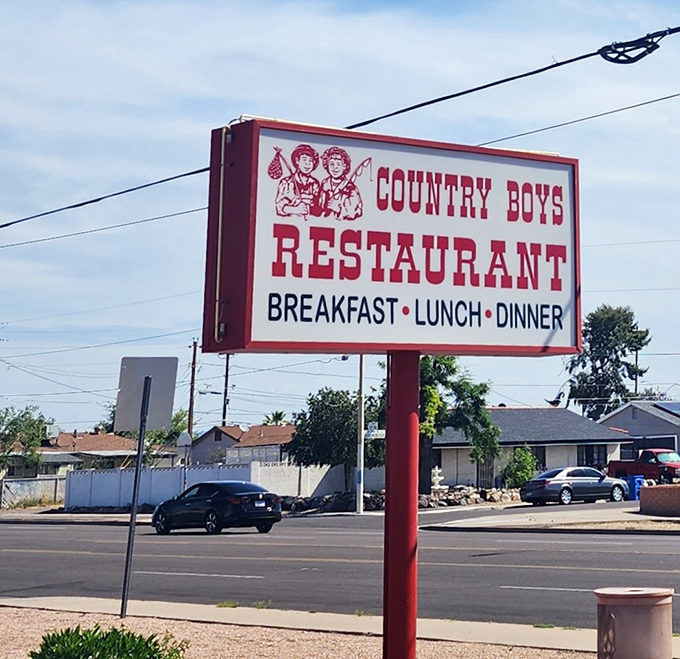 The iconic Country Boys sign stands as a beacon of hope for hungry travelers and a landmark for locals seeking comfort food salvation.