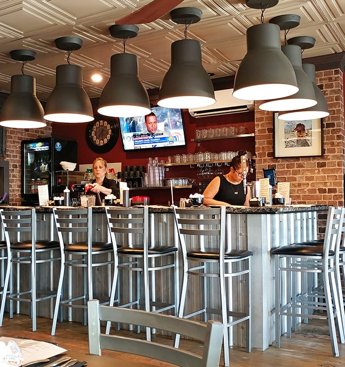 Behind the corrugated metal bar, the staff orchestrates morning happiness with the precision of symphony conductors wielding coffee pots instead of batons.