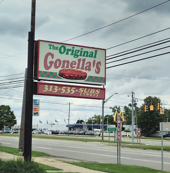 The roadside sign promises sandwich glory ahead. Like the North Star for hungry travelers, it guides you to your delicious destination.