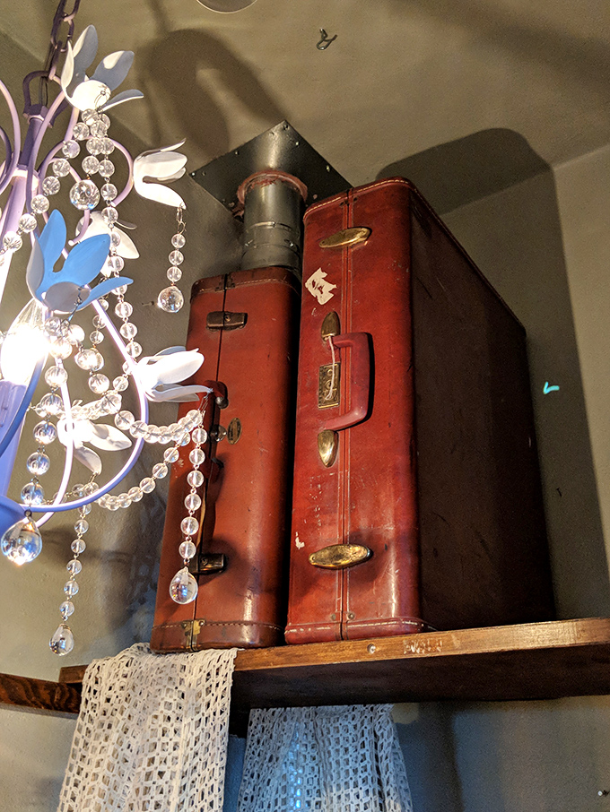 Vintage suitcases stacked high aren't just storage &ndash; they're vessels that once carried someone's hopes and dreams to destinations both near and far.