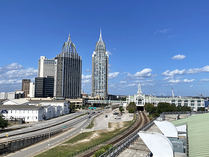 The twin towers of the RSA Battle House complex stand like exclamation points against Mobile's sky, architectural marvels that define the skyline.