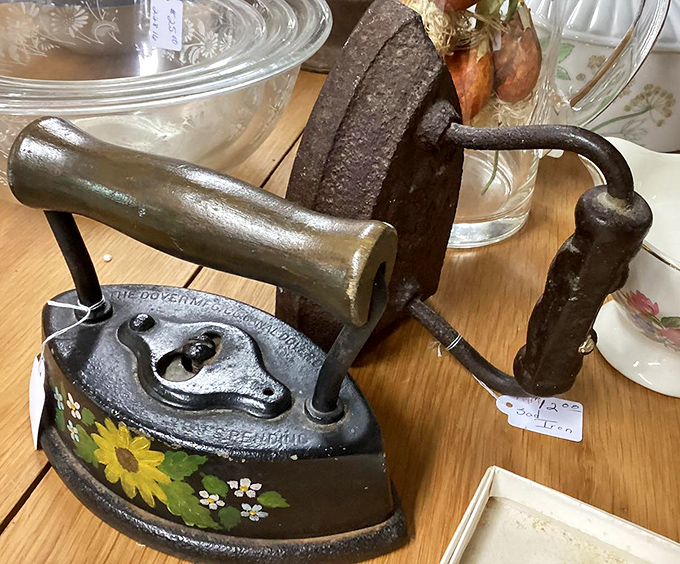 A hand-painted iron that once pressed Sunday best clothes. Before wrinkle-release spray, this heated heavyweight was the original "steam team."