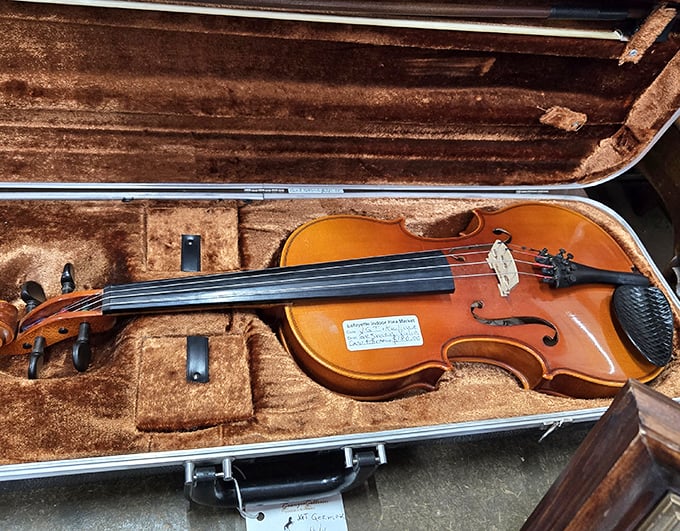 This violin has been waiting patiently in its velvet-lined case for someone new to make it sing again.