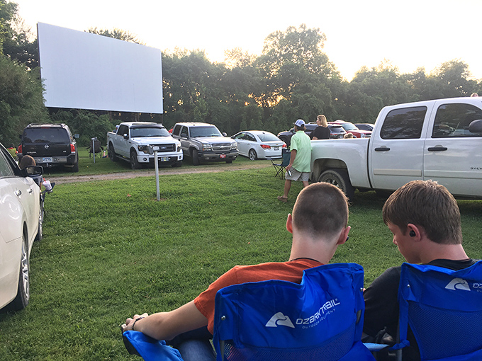 The anticipation is palpable as these young viewers settle into their camp chairs, ready for adventures larger than life on the big screen.