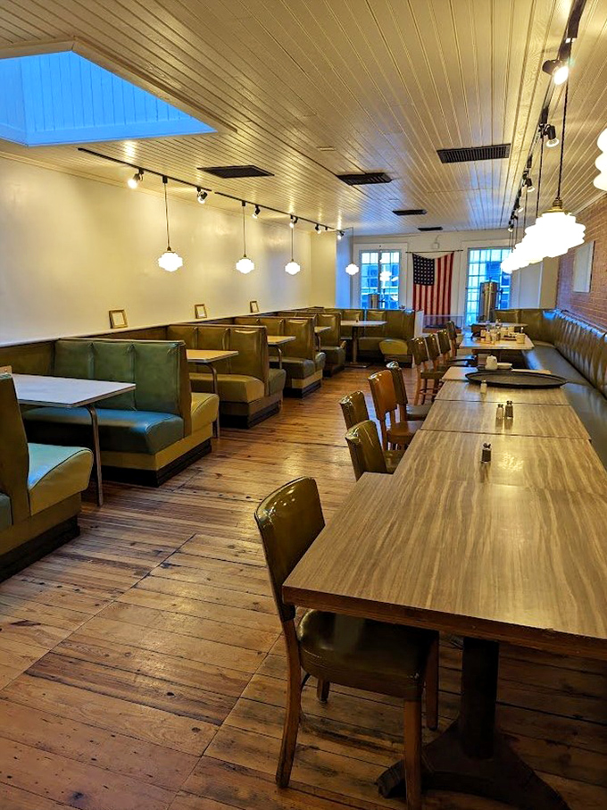 Warm wooden floors, olive green booths, and pendant lighting create the perfect backdrop for making memories over meatloaf and milkshakes.