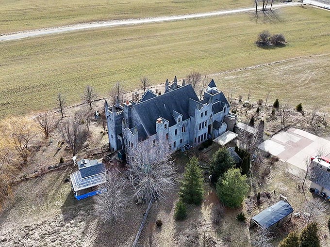From above, the castle's full medieval glory reveals itself against surprisingly ordinary Midwestern farmland surroundings.