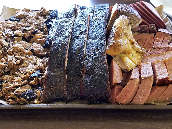 The barbecue platter that answers the eternal question: "Why choose one meat when you can have them all?" A smokehouse symphony on a single tray.