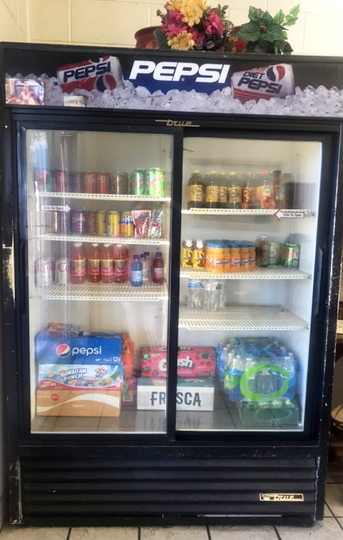 The beverage cooler stands ready. After that chile heat, nothing satisfies quite like an ice-cold soda to complete the perfect New Mexican breakfast experience.