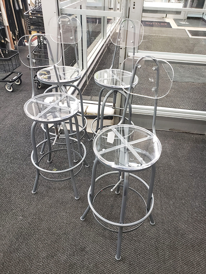 Clear acrylic bar stools await their forever homes. Opitz occasionally surprises with home d&eacute;cor finds that bring the same value proposition as their clothing selections.