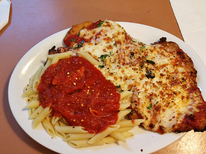 Chicken parm that's bigger than your plate and your expectations. That golden crust and blanket of melted cheese is the definition of comfort.