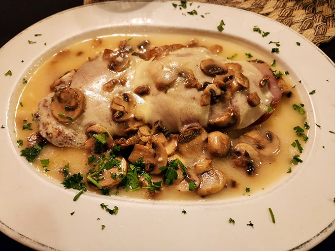 Chicken Marsala swimming in a mushroom sauce so good you'll be tempted to request a straw for the leftovers.