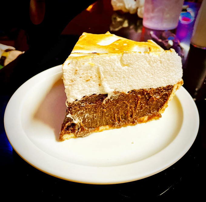 A slice of chocolate cream pie that makes you understand why people used to fight duels over lesser things.