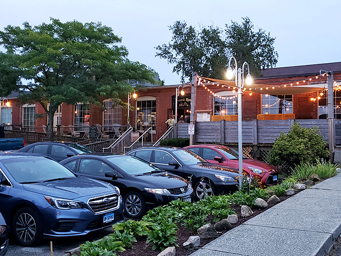 The Engine Room transforms into a twinkling oasis at dusk, where craft cocktails and local fare fuel conversations that stretch long into the evening.