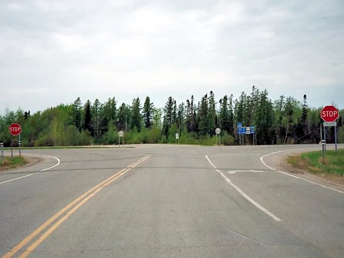 Civilization's gentle reminder that you're still in Minnesota. This intersection has directed countless adventurers toward memories waiting to be made.