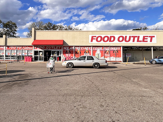 The no-frills Food Outlet promises grocery bargains with its bold red signage, a practical shopping option in a town where value matters.