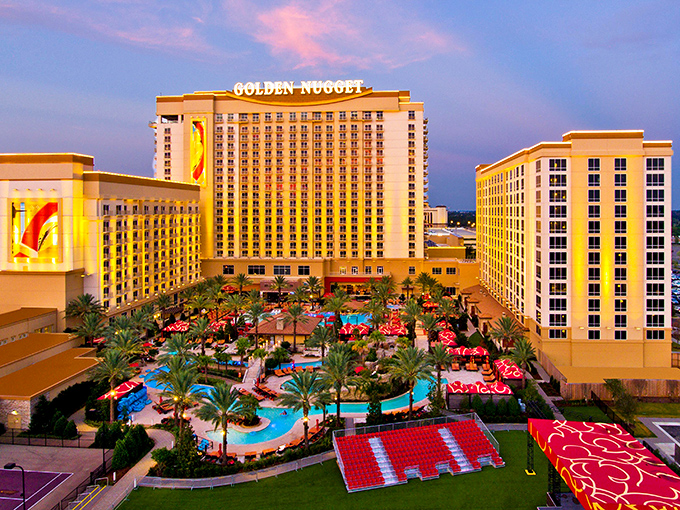 The Golden Nugget glitters against the Louisiana sky, offering poolside paradise that makes "staycations" feel like exotic adventures.
