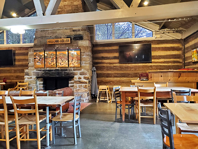 Hill & Holler's rustic interior combines log cabin coziness with modern comfort, creating the perfect atmosphere for lingering over local flavors.