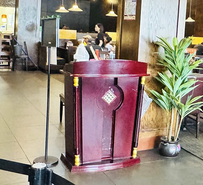 The host station stands guard like a sentinel of satiation, the gateway to a world where calories don't count and pants are merely suggestions.