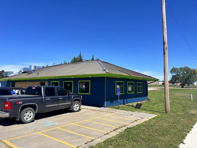 Huckleberry's blue exterior stands out against the prairie sky, a local landmark where stories are exchanged alongside orders.