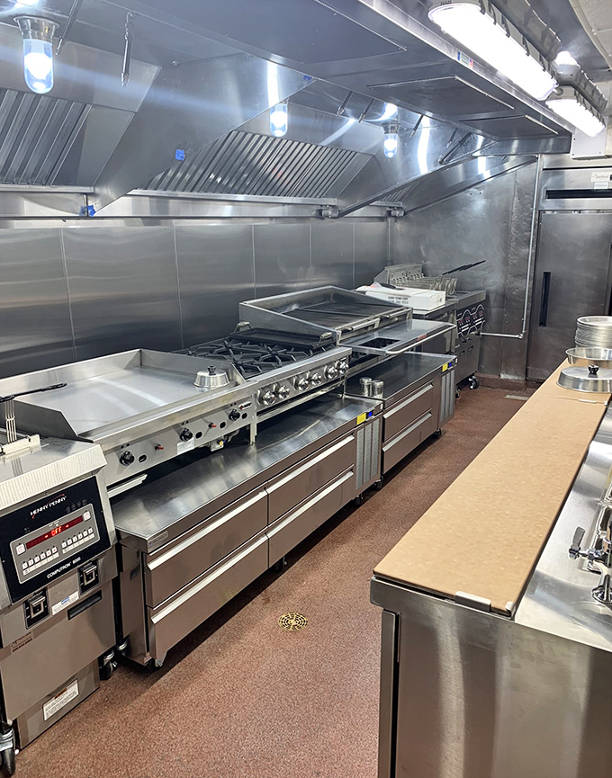 The spotless kitchen reveals the serious commitment behind casual dining&mdash;where your comfort food is prepared with professional pride and attention.