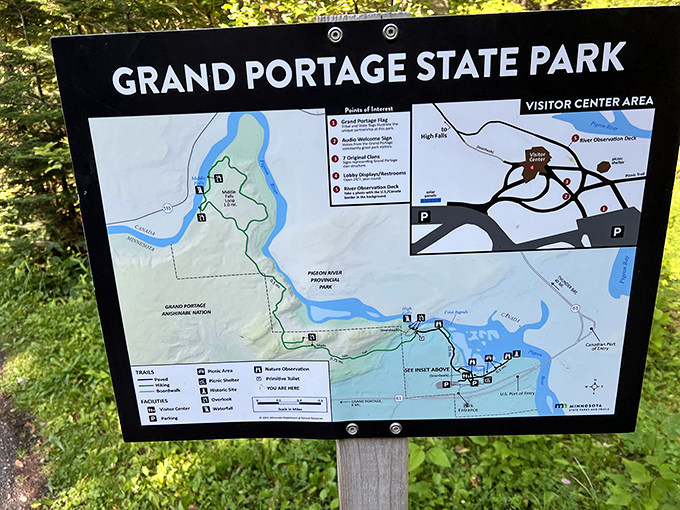 The entrance sign promises adventure while the stone foundation suggests this place has stories to tell.