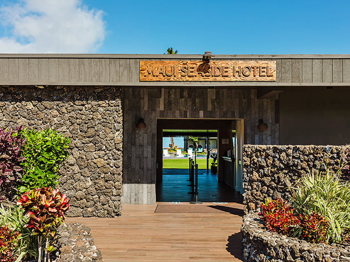 Maui Seaside Hotel's lava rock entrance welcomes visitors with that distinctive island architecture that says "you're definitely in Hawaii now."