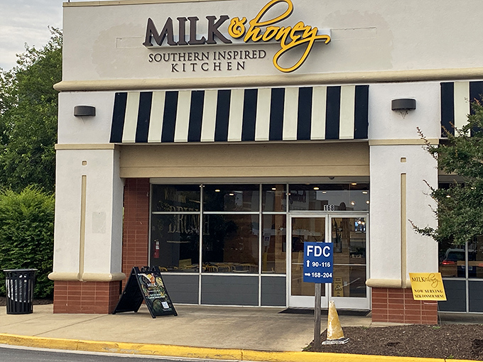 Milk & Honey's Southern-inspired kitchen promises comfort food that might just rival your grandmother's recipes. That black and white awning signals serious culinary business inside.